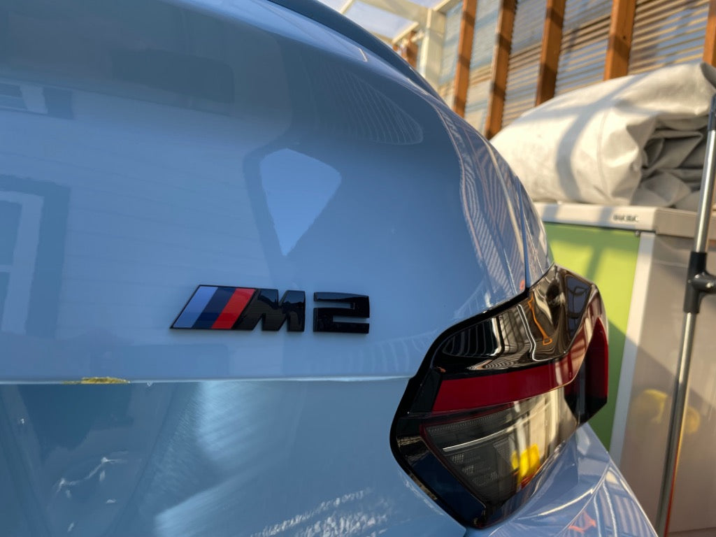 Genuine BMW M2 Black Badge Trunk Emblem M2 G87 & F87 | MODE Auto Concepts